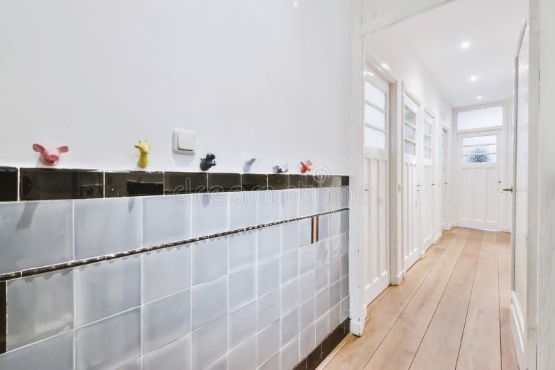 A Long Corridor with a Tiled Wall Stock Photo - Image of luxury, modern ...