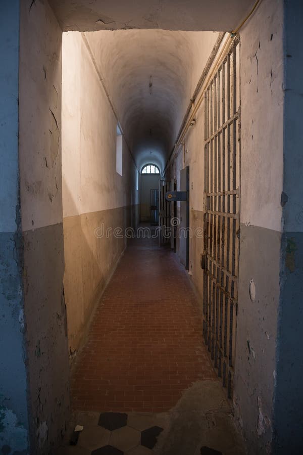 Long Corridor and White and Worn Walls of a Prison Stock Photo - Image ...