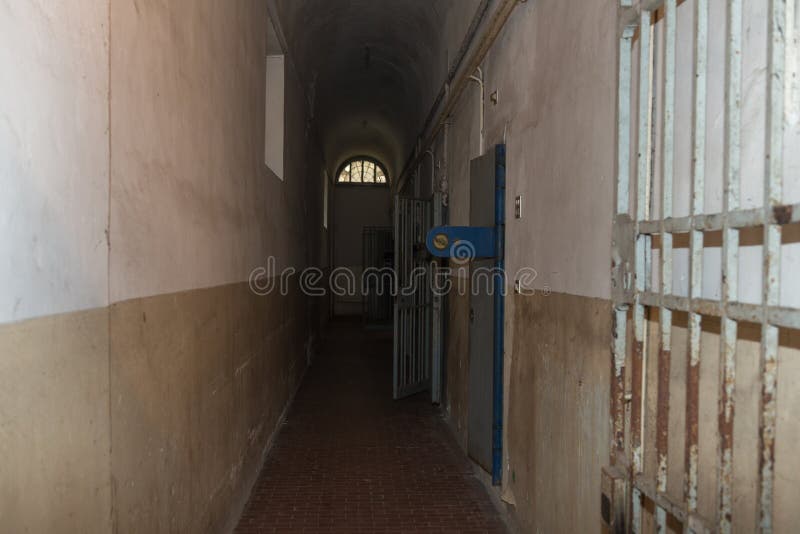 Long Corridor and White and Worn Walls of a Prison Stock Photo - Image ...