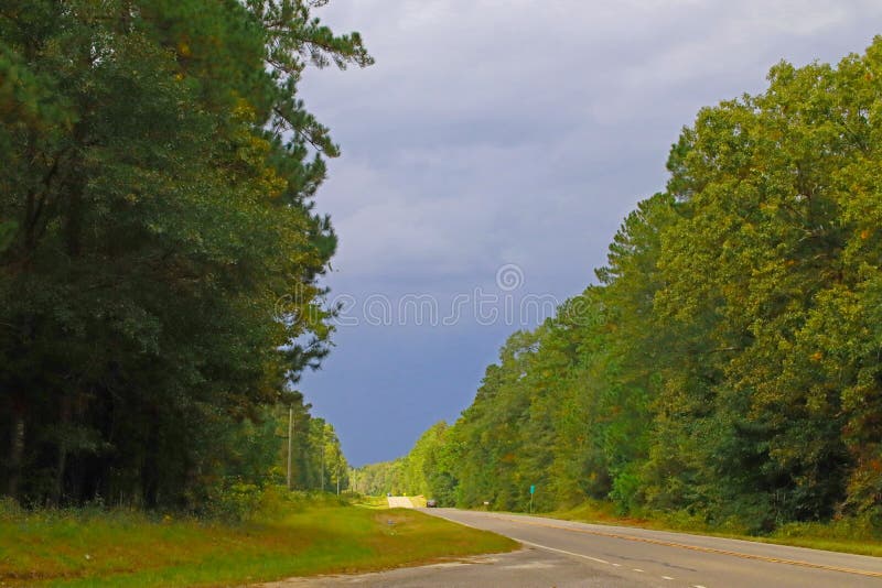 A long country road stock photo. Image of long, clouds - 51089950