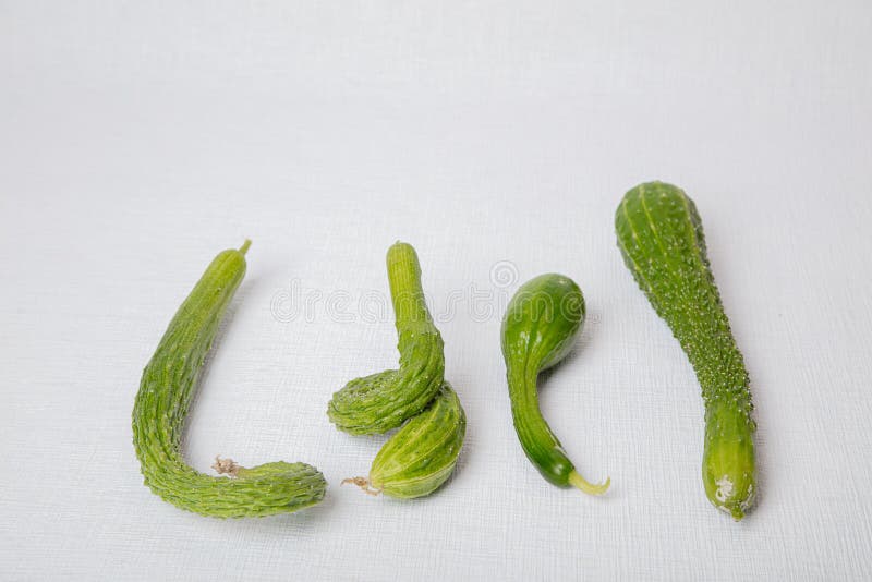 Crooked Cucumbers. Cucumber Grown with Incomplete Watering. Diseases of ...