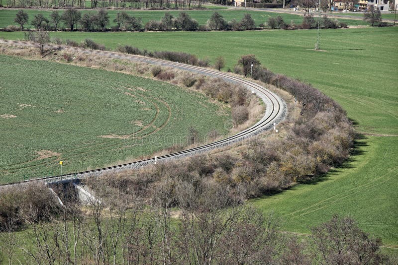 Long Curved Train Track between Fields on Spring Stock Photo - Image of ...