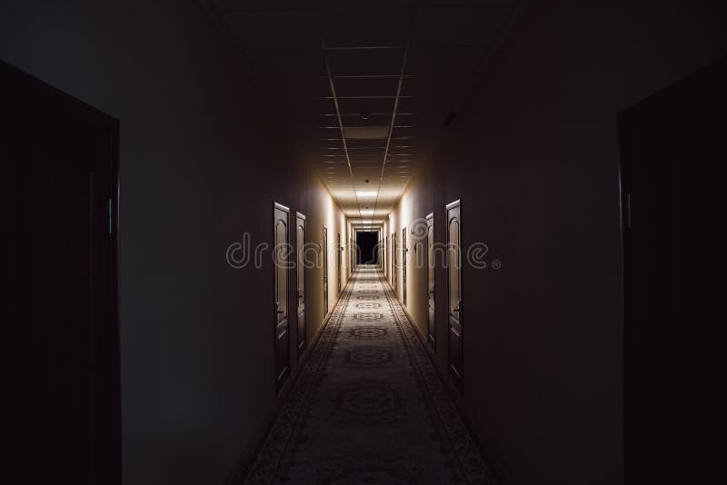 Long Dark Corridor with Many Doors and Light Stock Photo - Image of ...