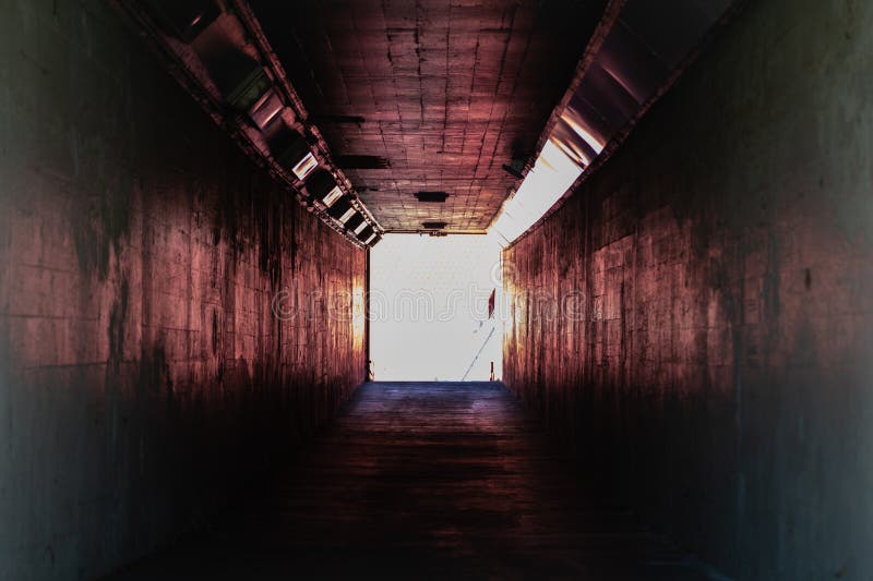 Long Dark Walkway with Light at the End of Tunnel Stock Image - Image ...