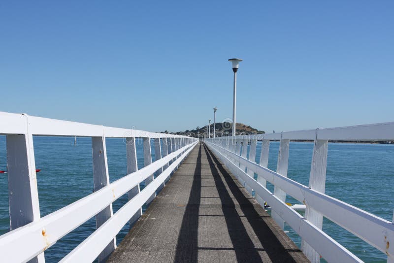 Long Deserted Jetty into Auckland Harbour Stock Photo - Image of ...