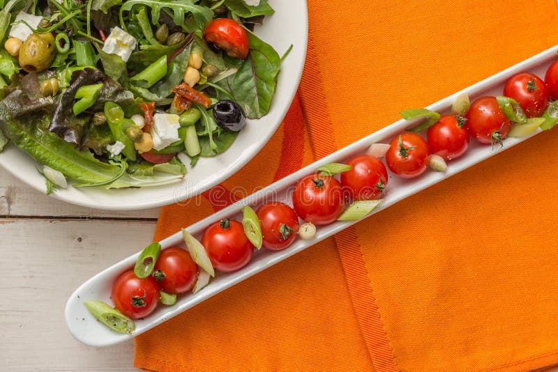 Long Dish with Cherry Tomatoes and a Green Salad Stock Image - Image of ...