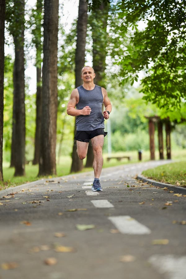 Long Distance Runner Training in the Park Stock Photo - Image of alley ...