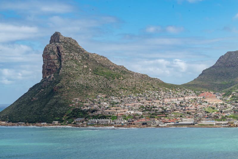 Long-distance View of a Mountain Peak with a City at Its Base Next To ...