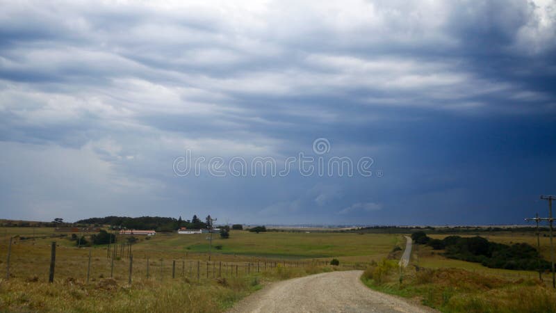 Long Dusty Road with Green Grass Stock Photo - Image of morning, town ...