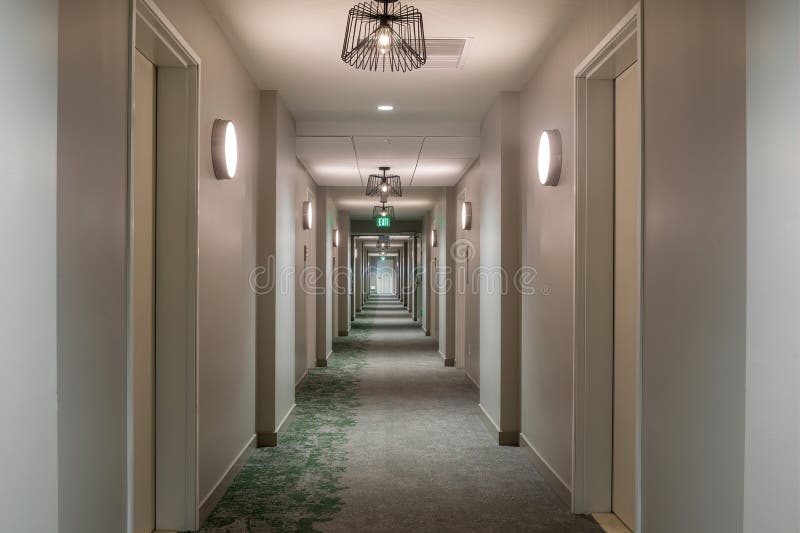 A Long Empty Hotel Hallway stock image. Image of inside - 392329043
