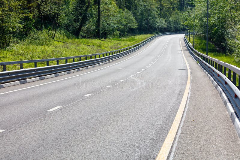 A Long, Empty Road with a White Line Down the Middle Stock Image ...