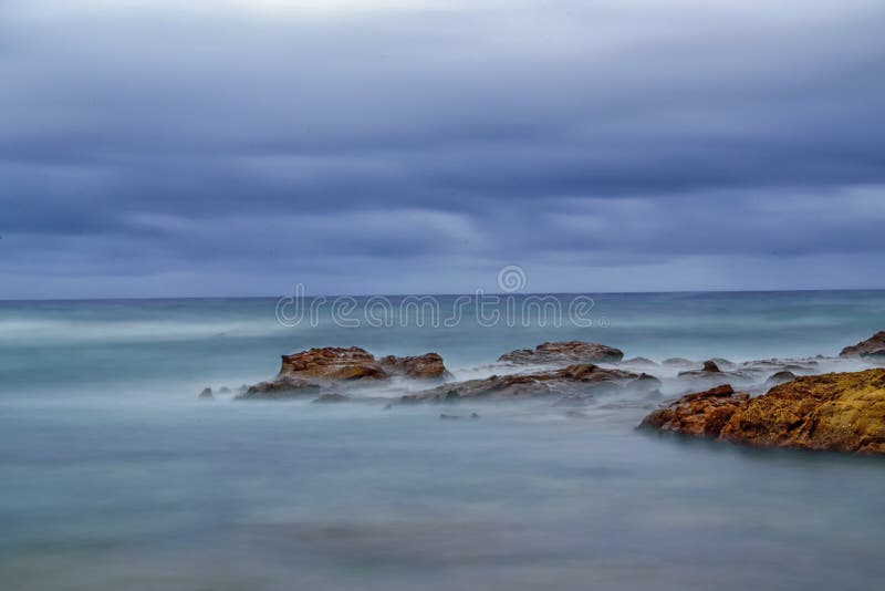 Long Exposure Photo of Rocks and Ocean Stock Image - Image of coast ...