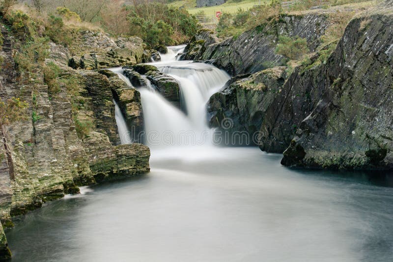 Long Exposure of a Beautiful Waterfall Cascading Down a Steep, Rocky ...