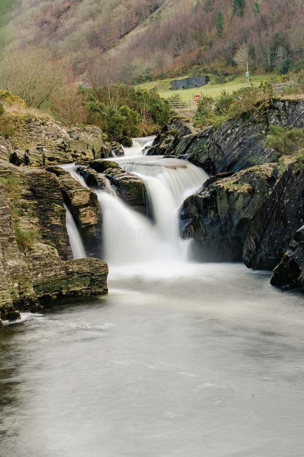 Long Exposure of a Beautiful Waterfall Cascading Down a Steep, Rocky ...