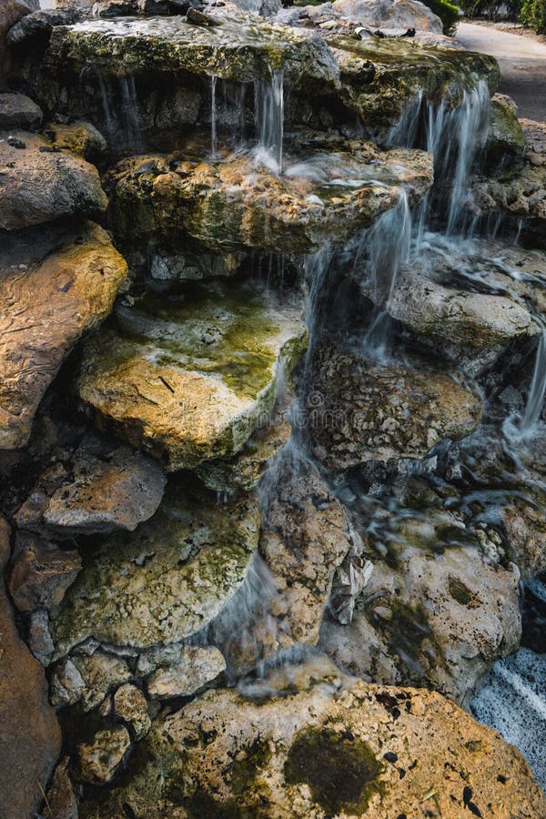 Long Exposure of a Beautiful Waterfall Falling Down the Mossy Rocks ...