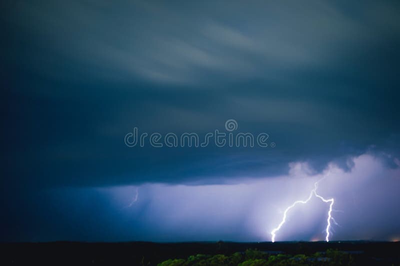 Long Exposure of Dramatic Clouds in the Sky and Lightning Illuminating ...