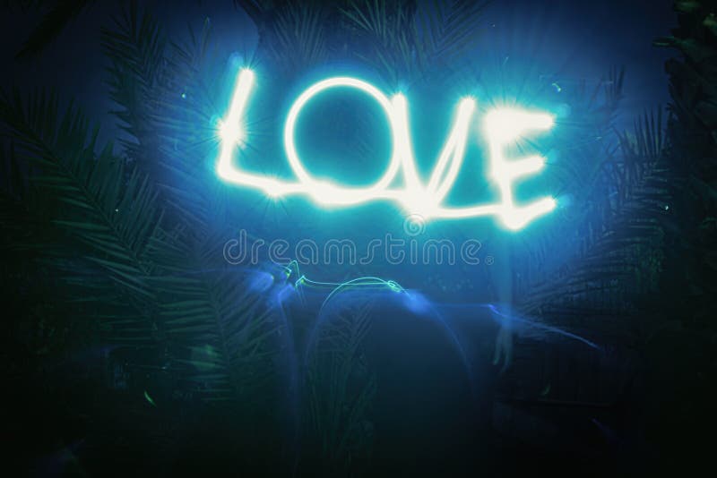 Long Exposure of Female Drawing Love Message with a Bright Light Stock ...