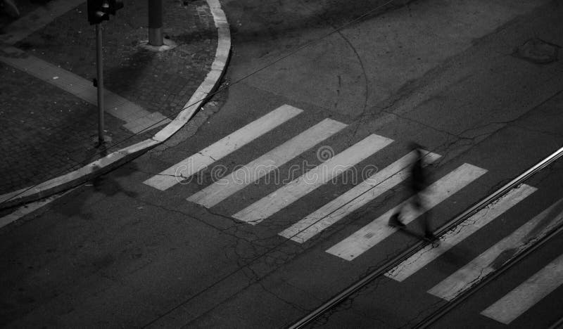 Long Exposure Grayscale of a Person Passing a Street during the ...