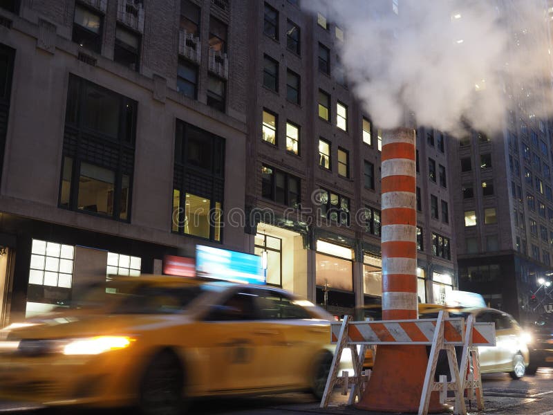 Long Exposure Image of a Cab Passing by a Steam Stack in New York ...