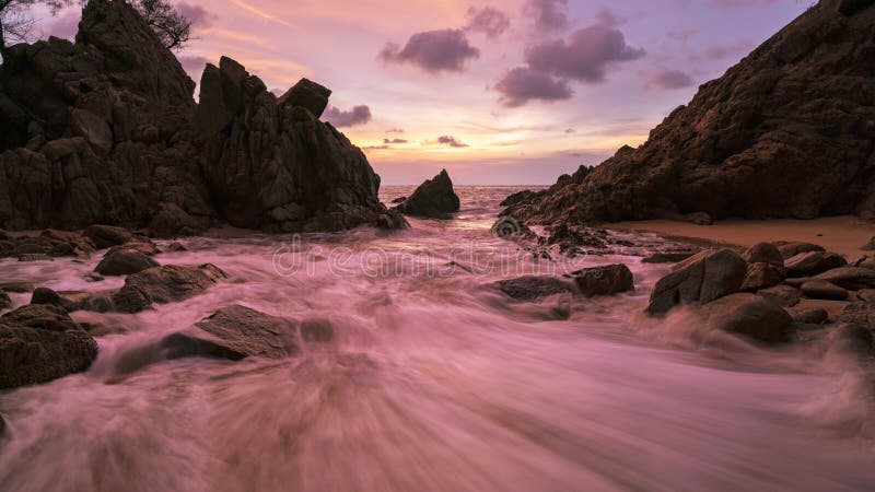 Long Exposure Image of Dramatic Sky Seascape with Rock in Sunset ...