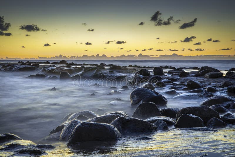 Long Exposure Image of Dramatic Sky Seascape with Rock in Sunset ...