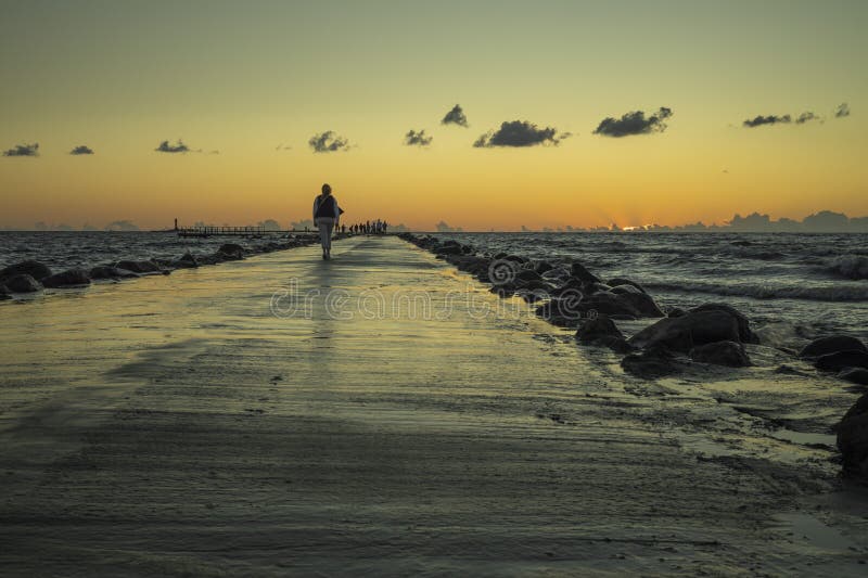 Long Exposure Image of Dramatic Sky Seascape with Rock in Sunset ...