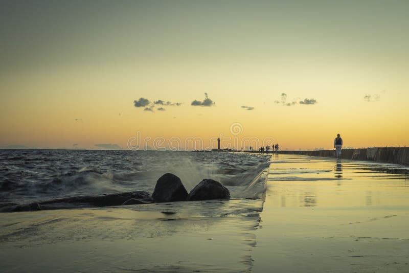 Long Exposure Image of Dramatic Sky Seascape with Rock in Sunset ...