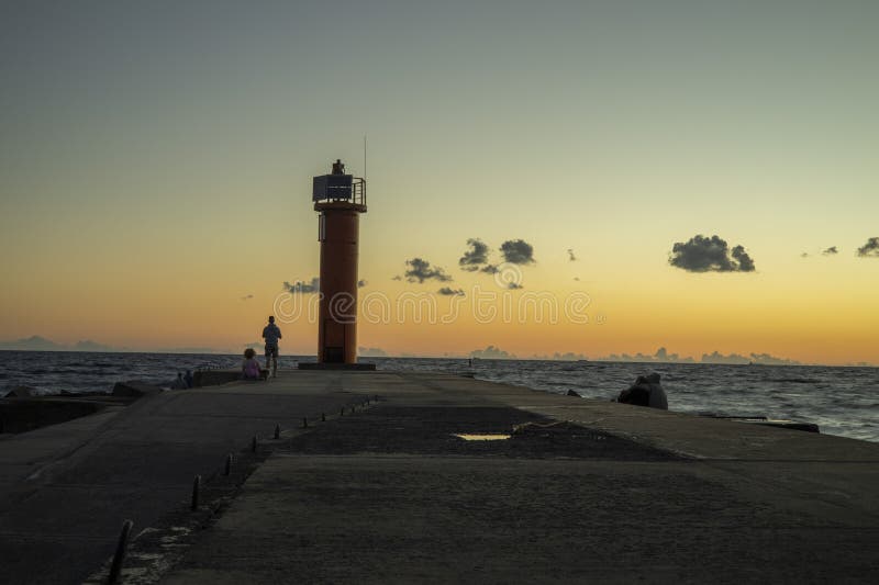Long Exposure Image of Dramatic Sky Seascape with Rock in Sunset ...