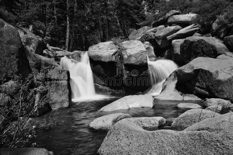 Long Exposure Image of a Waterfall Flowing Over Rocks in Black and ...
