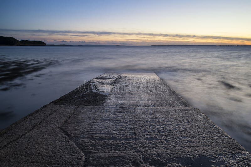 Long Exposure Landscape Image of Pier at Sunset in Summer Stock Image ...