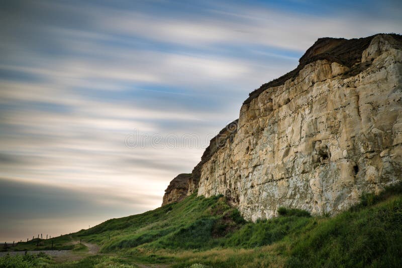 Long Exposure Landscape of Motion Blur Sky Over Vibrant Cliffs Stock ...