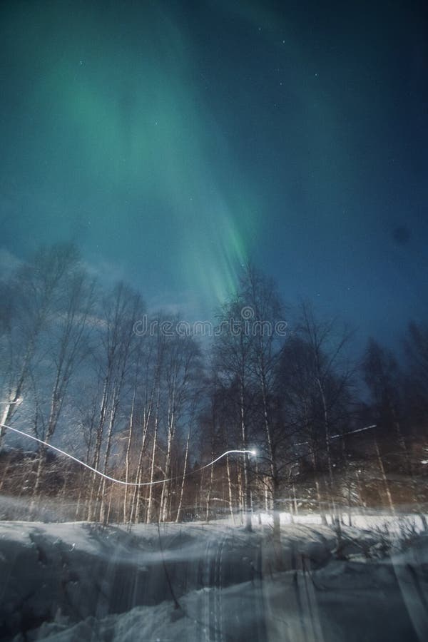 Long Exposure of Lights Under Aurora Borealis in Rovaniemi, Lapland ...