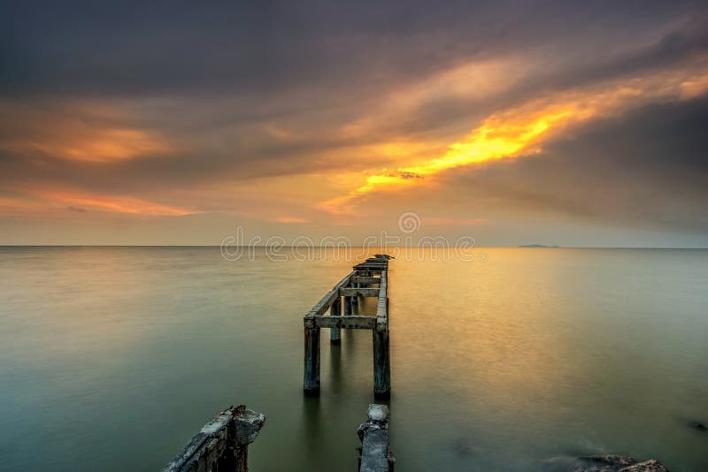 A Long Exposure Picture of Abandoned Old Jetty with Cloudy before ...