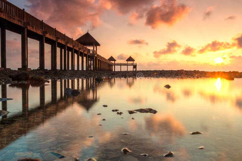 A Long Exposure Picture of Golden Sunrise with Stone Jetty with Stock ...