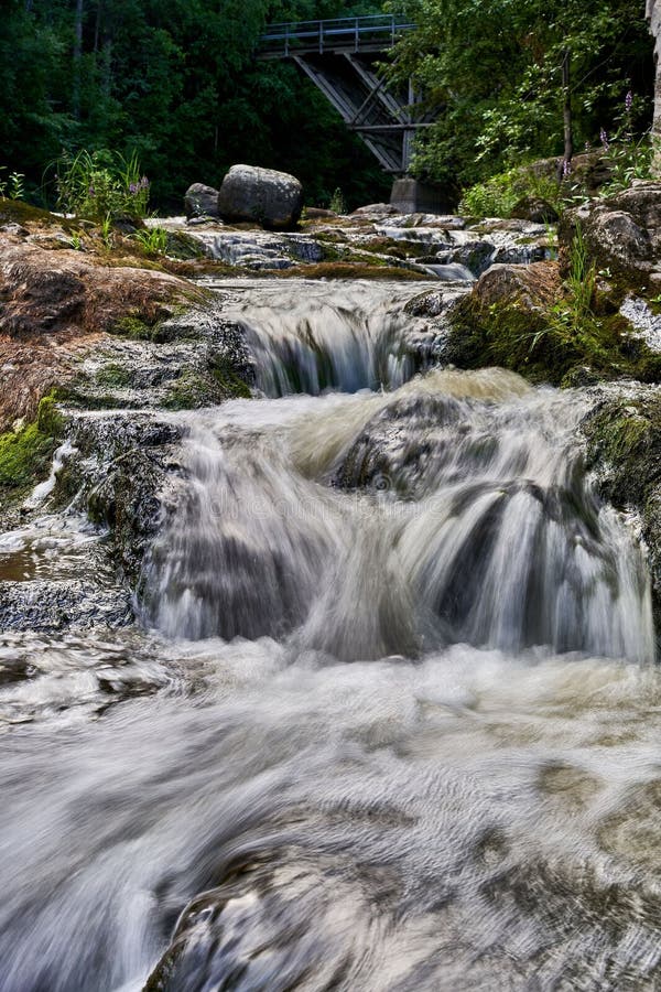 Long-exposure of a Picturesque River Running Over Smooth Rocks Stock ...