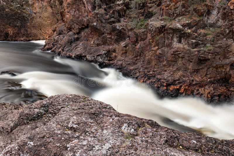 Long Exposure of Rapid Mountain River Flowing through the Rocks Stock ...