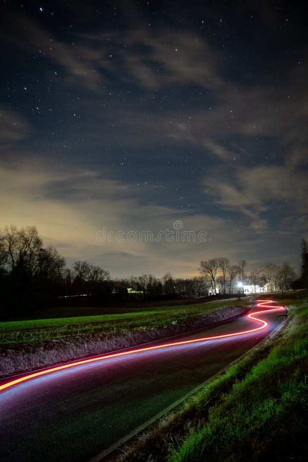 Long Exposure of Red Light on the Road with a Starry Night Sky ...