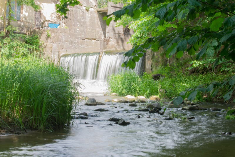 Long Exposure River with Rocks and Waterfall Stock Photo - Image of ...