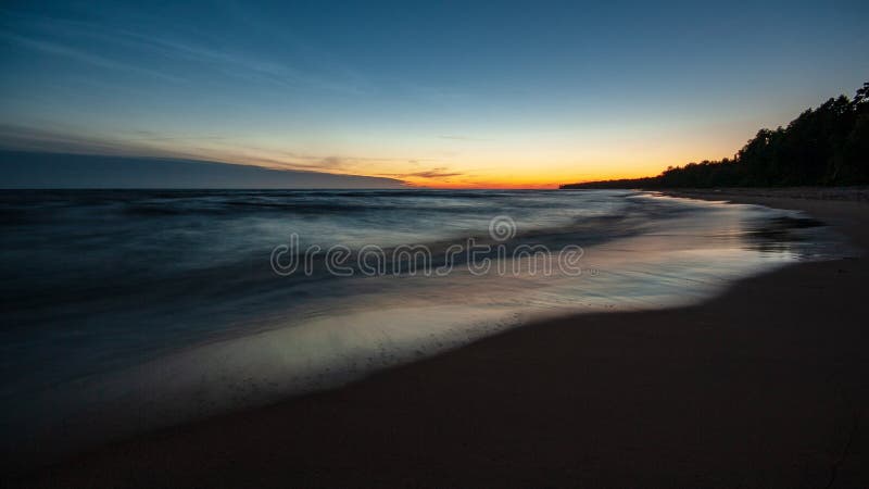 Long Exposure Sea Beach with Rocks and Washed Out Waves of Water Stock ...