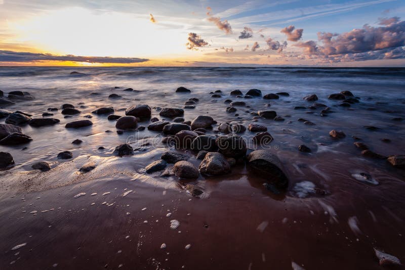 Long Exposure Sea Beach with Rocks and Washed Out Waves of Water Stock ...