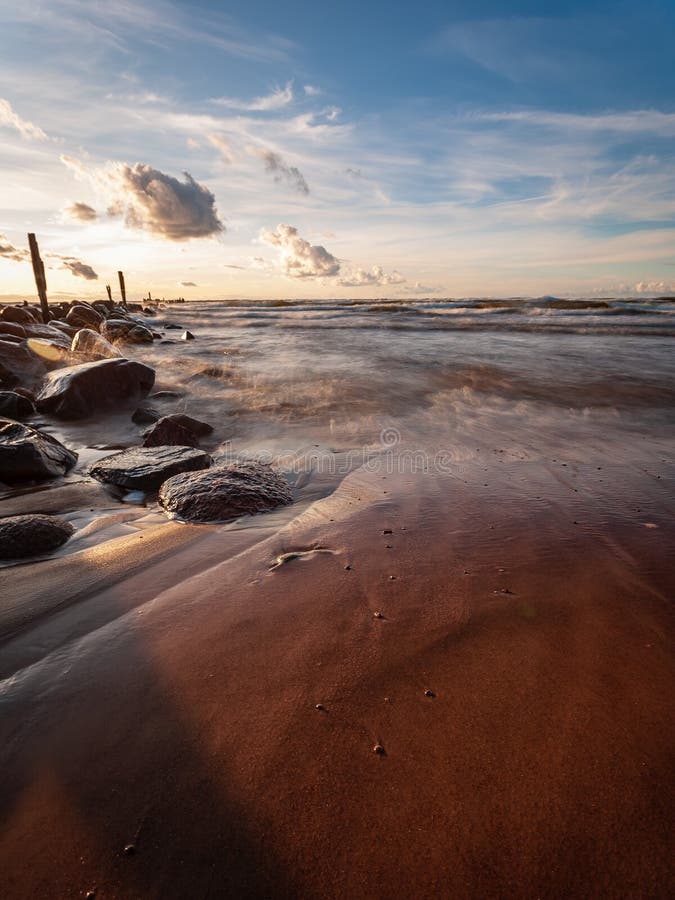 Long Exposure Sea Beach with Rocks and Washed Out Waves of Water Stock ...