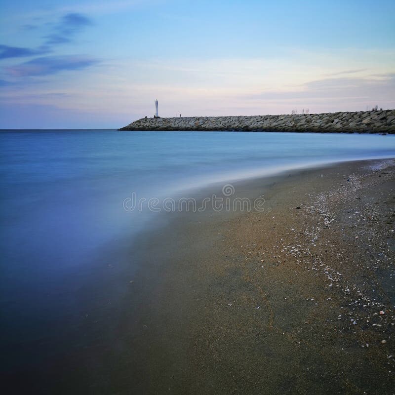 Long Exposure of Sea with Lighthouse on the Rock Stock Photo - Image of ...