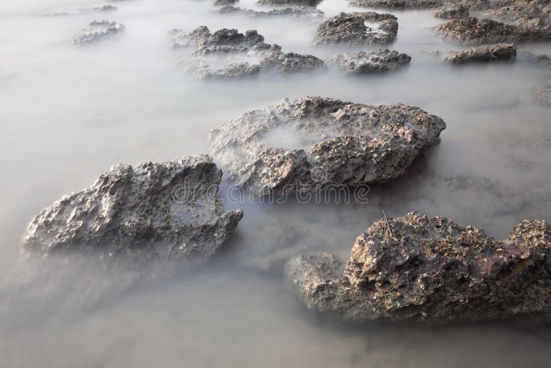 Long Exposure of Sea and Rocks. Stock Image - Image of dark, beach ...