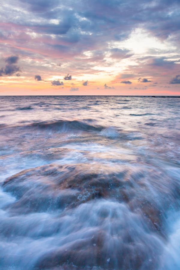 Long Exposure Sea and Rocks at Twilight Stock Photo - Image of rough ...