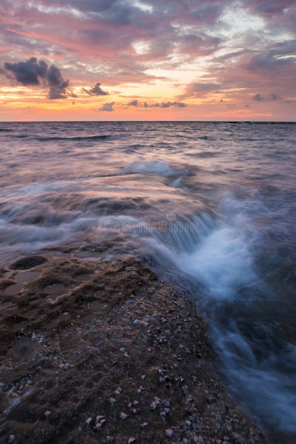 Long Exposure Sea and Rocks at Twilight Stock Photo - Image of long ...