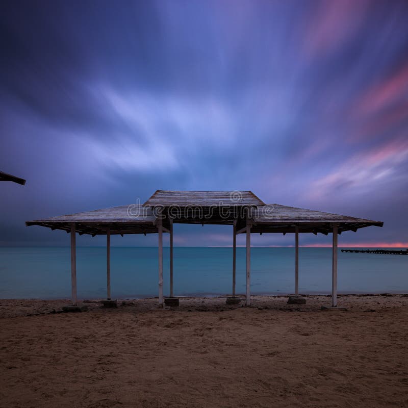 Long Exposure Sea Wooden Canopy on the Beach at Sunset Stock Photo ...
