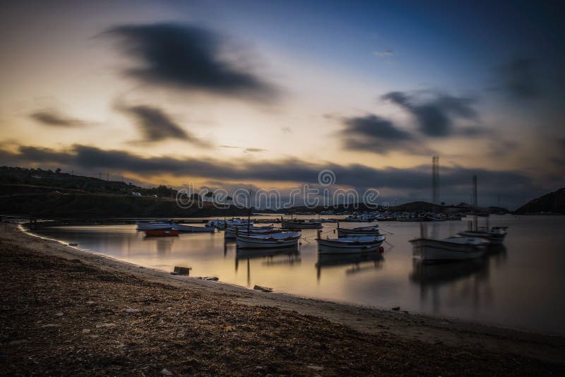 Long Exposure Shot of the Boats in the Sea Stock Photo - Image of coast ...
