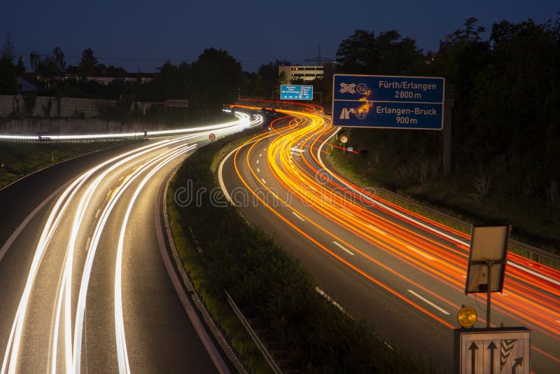 Long Exposure Shot of Car Lights on a Dark Highway Stock Photo - Image ...