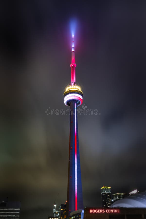 Long Exposure Shot of the CN Tower in Toronto at Night Under Clouds ...