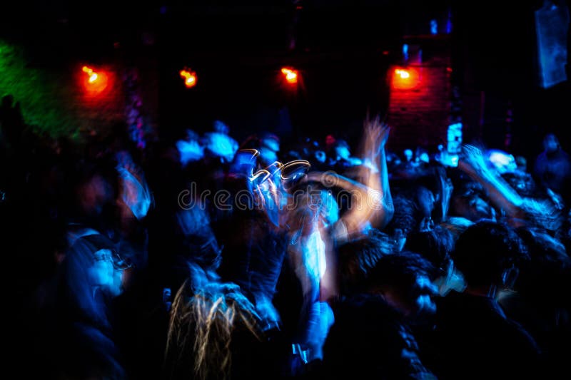 Long Exposure Shot of the Crowd at a Rap Concert at Night with Red ...